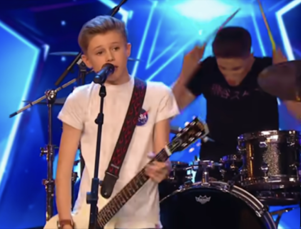 The three guitar players and drummer wowed the audience and judges with ...